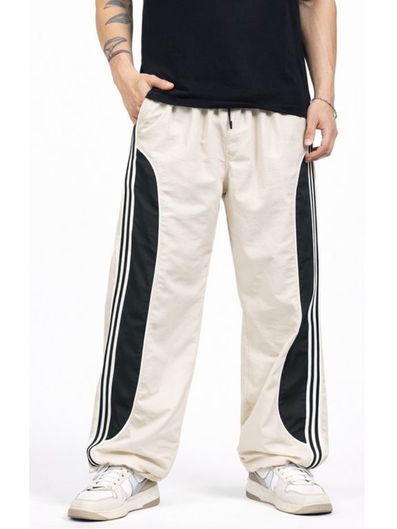 Pantalón Power Track Oversized Tela Mojada Hueso Hombre ENKI ...
